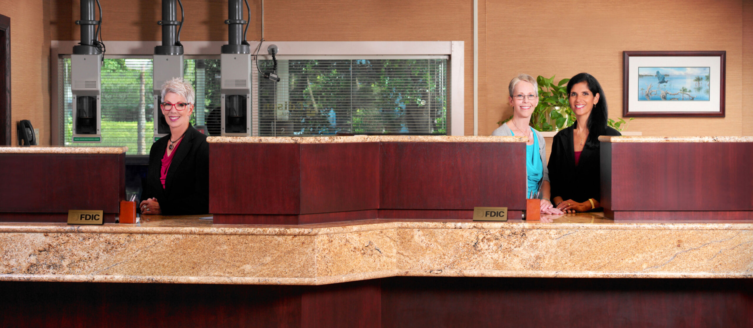 Bankers Standing Behind Counter | Edison National Bank